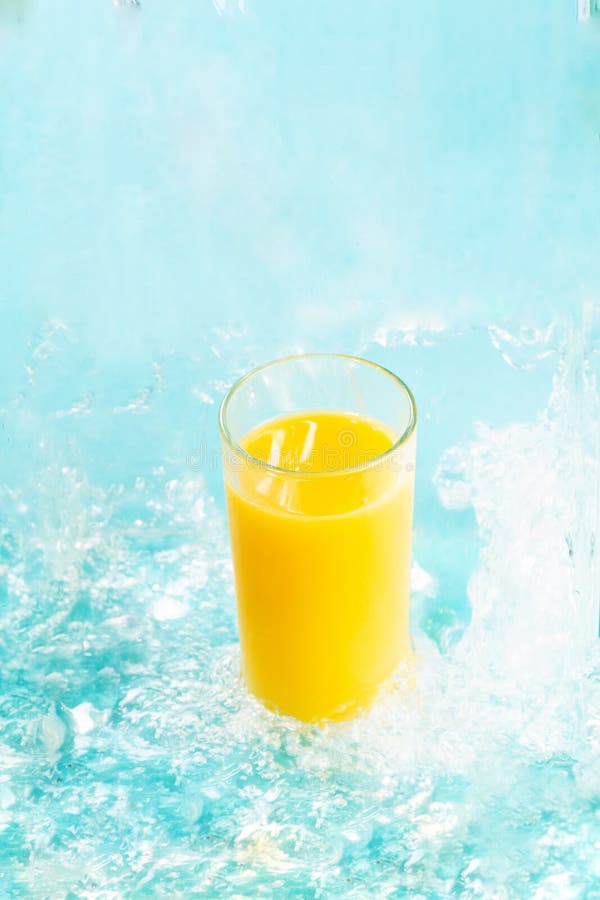 Glass of Fresh Orange Juice in Splashes of Water Stock Image - Image of ...