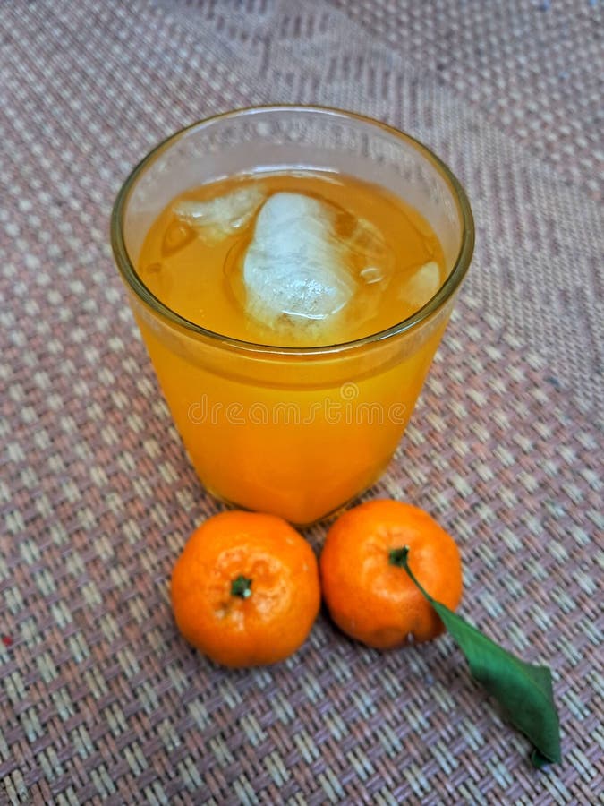 A Glass of Fresh Orange Juice Using Tube Ice Stock Photo - Image of ...