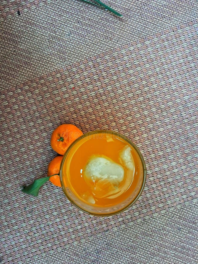 A Glass of Fresh Orange Juice Using Tube Ice Stock Photo - Image of ...