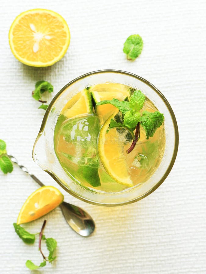 Glass of Fresh Orange Tea with Mint Leaf on White Background Stock Image - Image of orange ...