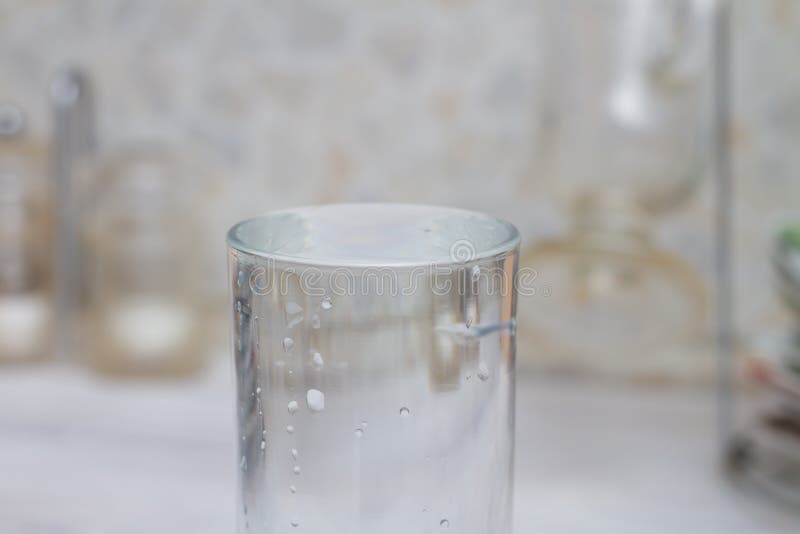 A Glass Full of Clear Water Sits on the Kitchen Table. Copy Space Stock ...