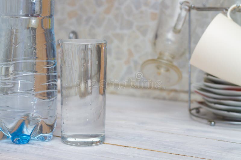 A Glass Full of Clear Water Sits on the Kitchen Table. Copy Space Stock ...