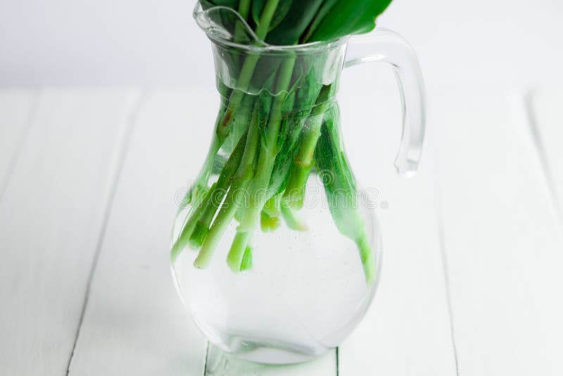 Glass Gar with Flowers on Wood Table Stock Photo - Image of floral ...