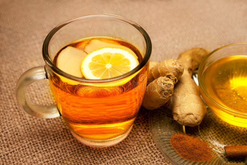 Glass of Ginger Tea with Lemon, Raw Ginger, Cinnamon and Honey Stock ...