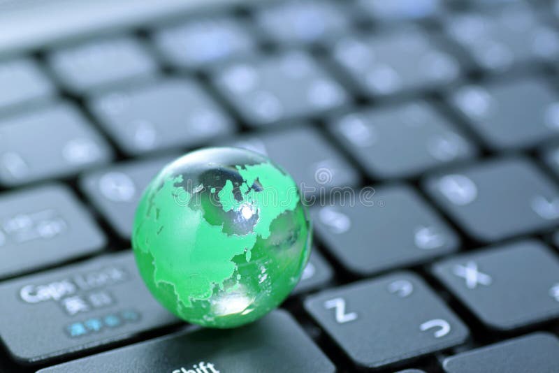 Glass globe over keyboard stock image. Image of earth - 22283887
