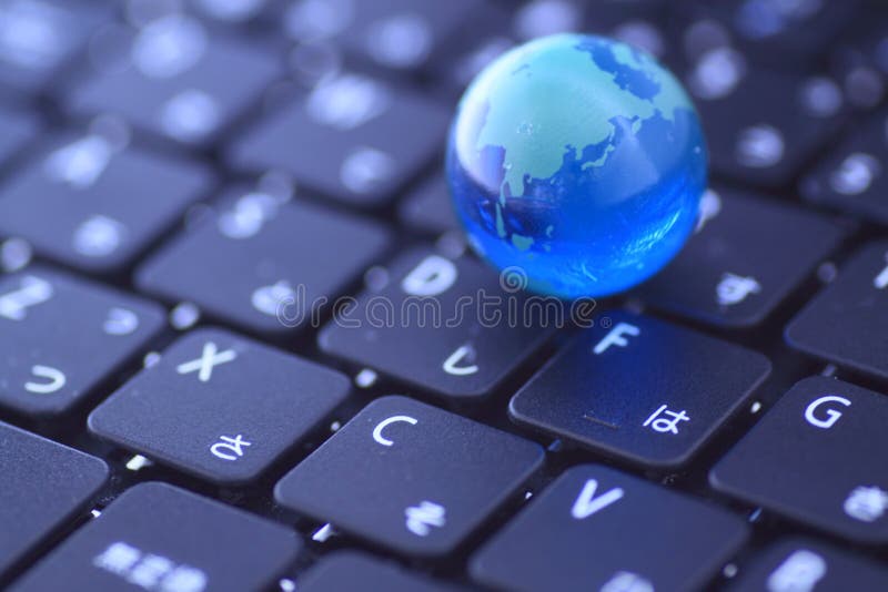 Glass globe over keyboard stock image. Image of earth - 22283887