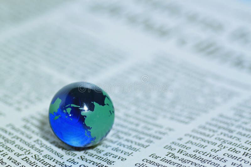 Glass globe over newspaper stock image. Image of transparency - 23696087