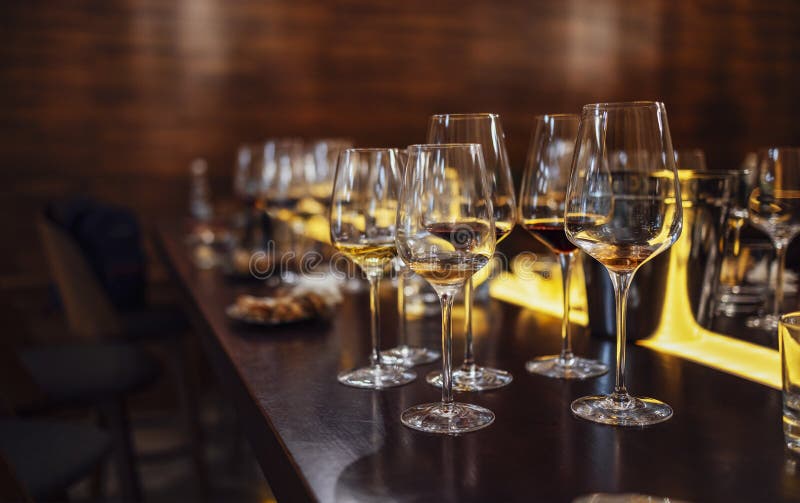 Glass Goblets Placed in Rows on Table during Wine Tasting Procedure in ...