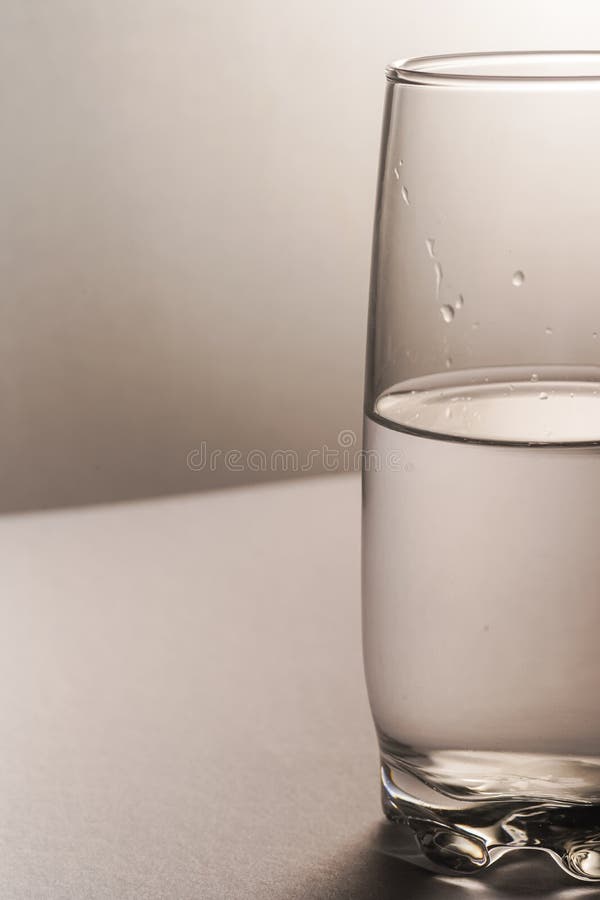 Glass Half Empty or Glass Half Full Stock Image - Image of clean ...