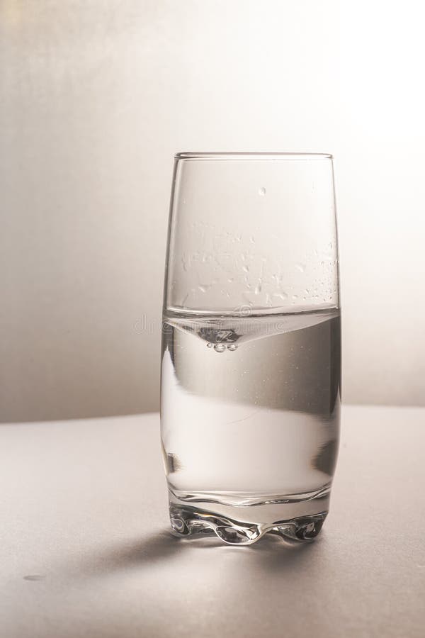 Glass Half Empty or Glass Half Full Stock Image - Image of isolated ...