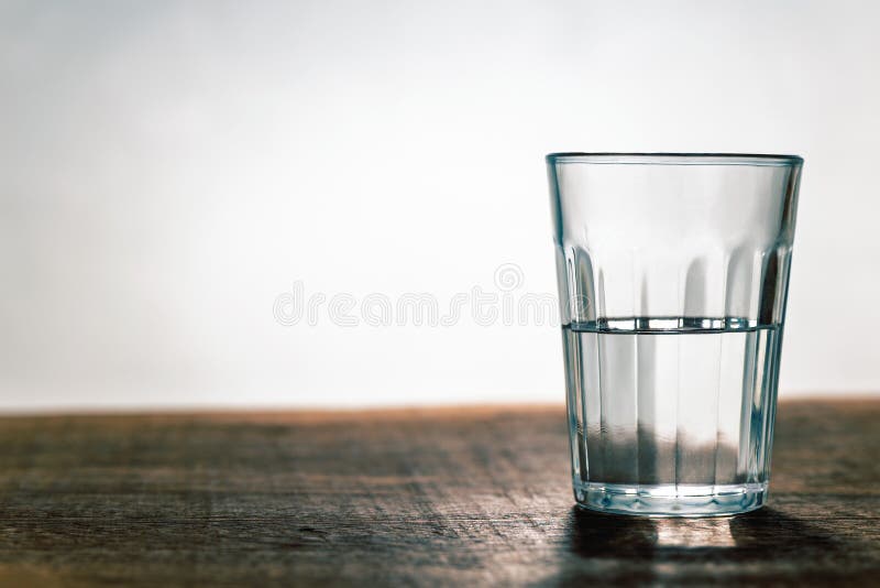 A glass half full stock image. Image of background, mindset - 364427039