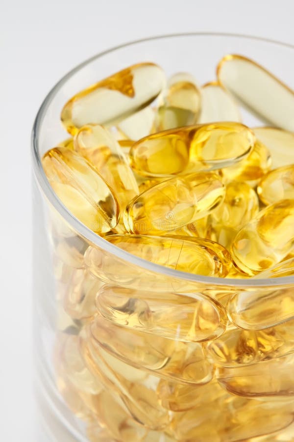 Glass of Health with Fish Oil Capsules Stock Photo - Image of glass ...