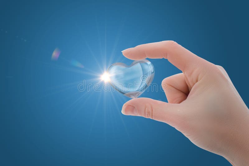 Glass heart in hand. stock image. Image of beloved, mercy - 85414957