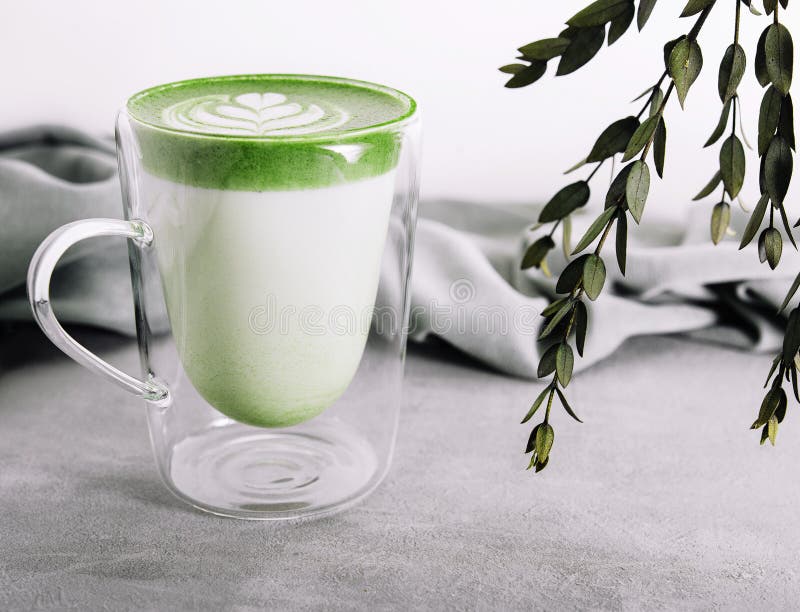 Glass of Hot Matcha Green Tea Latte with Tulip Pattern Stock Image ...