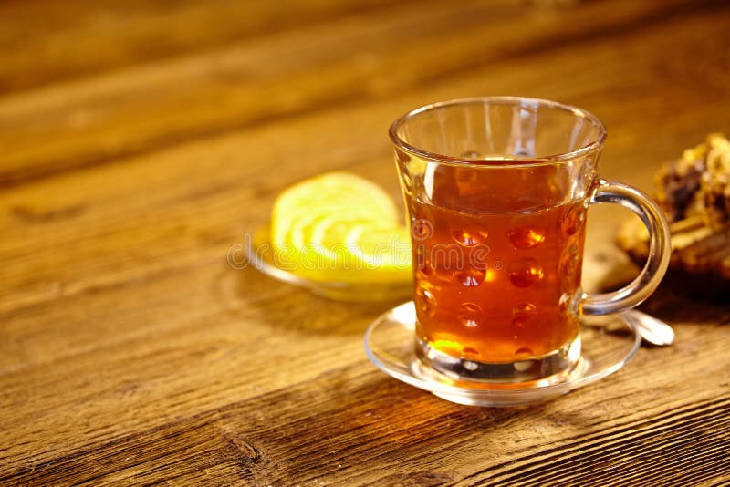 Glass of Hot Tea on Wooden Table. Stock Photo - Image of home, evening ...