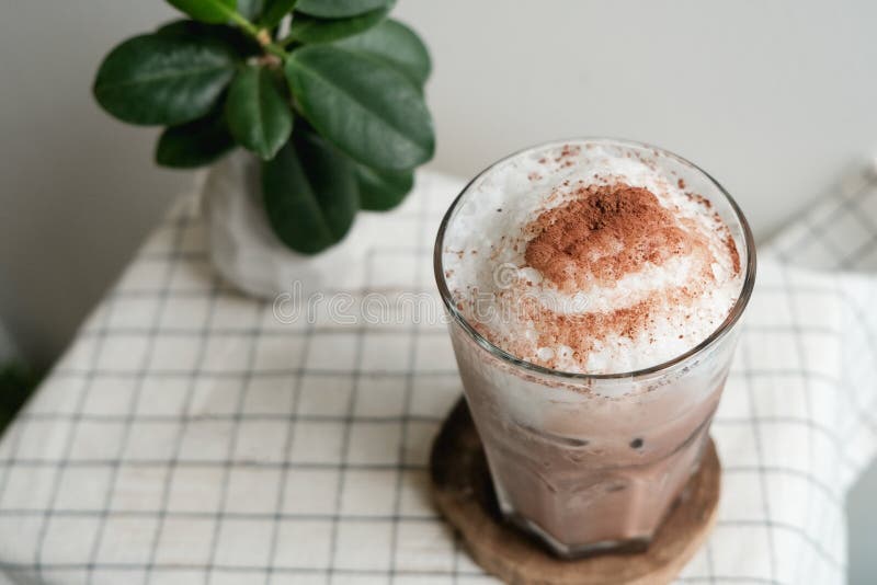 A Glass of Ice Chocolate Latte on Wood Plate Stock Image - Image of ...