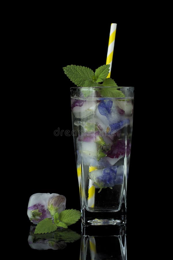 Glass with Ice, Cold Water Fresh Mint and Edible Flowers Stock Photo ...
