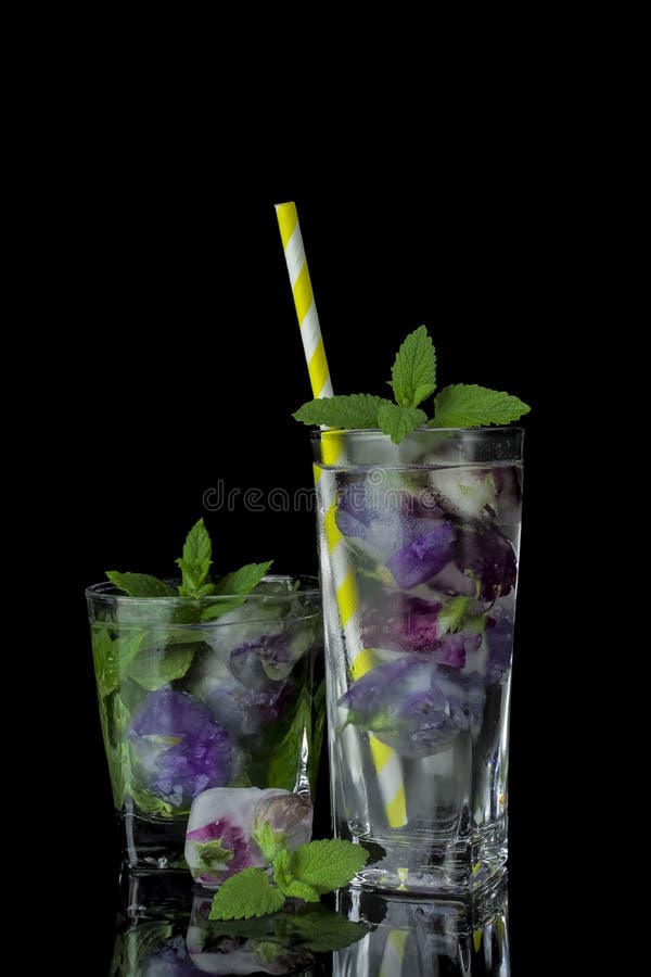 Glass with Ice, Cold Water Fresh Mint and Edible Flowers Stock Image ...