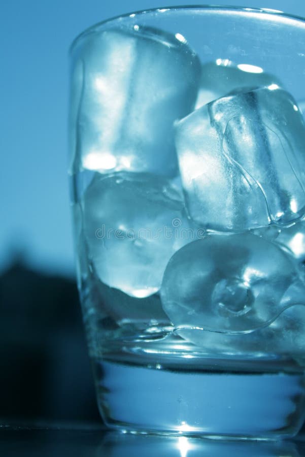 Glass with ice cubes stock photo. Image of cold, close - 143176070