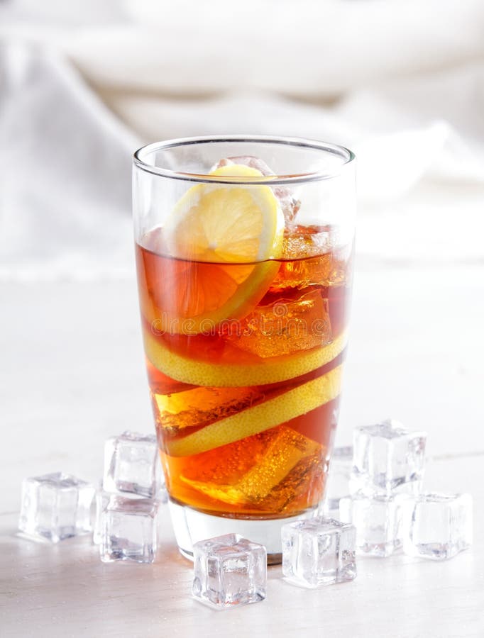 A Glass of Ice Lemon Tea with Lemon Slice and Ice Cubes Stock Photo ...