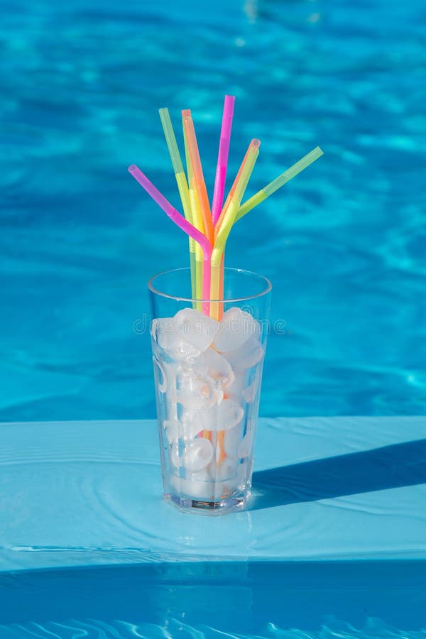Glass with Ice and Straws Ice Near the Pool Stock Photo - Image of pool ...