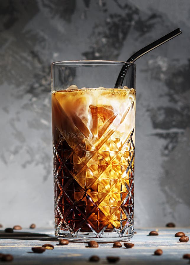 A Glass of Iced Coffee with Milk Against a Concrete Wall Stock Image ...