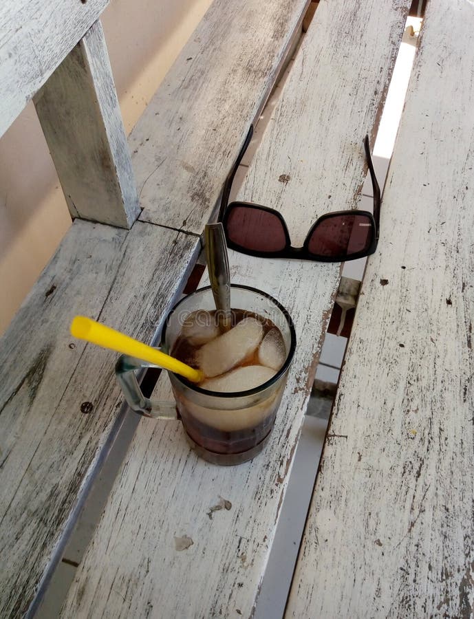 A Glass of Iced Tea in Chair Stock Image - Image of table, furniture ...