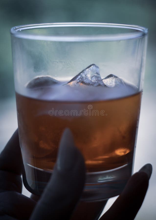 A Glass of Iced Tea in a Woman S Hand Stock Photo - Image of dessert ...