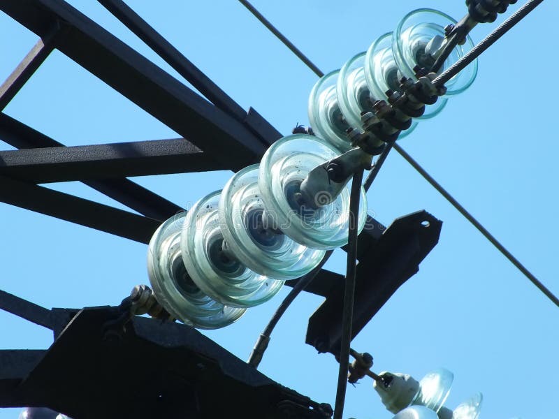 Glass Powerline Insulator Disks Against Blue Sky Background Stock Image ...