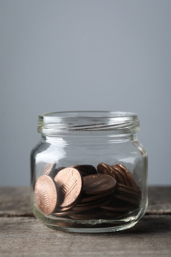 Glass Jar with Coins on Wooden Table, Closeup Stock Photo - Image of ...