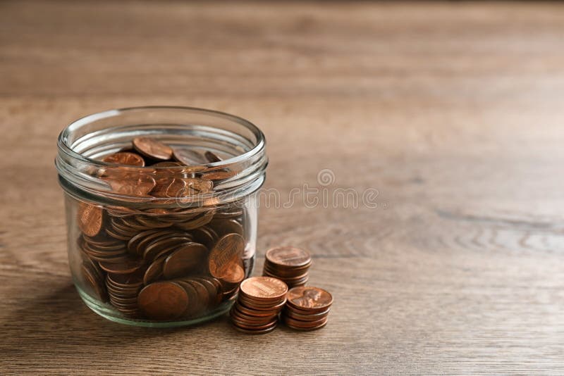 Glass Jar with Coins on Wooden Table, Space for Text. Stock Image ...