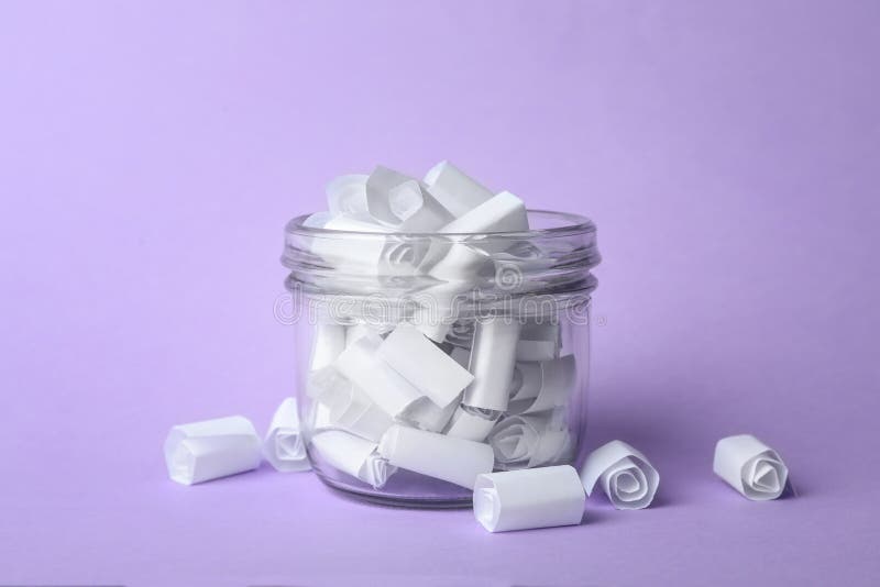 Glass Jar Full of Rolled Paper Sheets on Blue Background, Space for ...