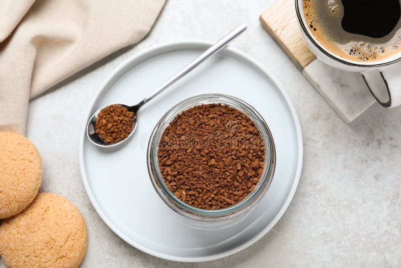 Glass Jar of Instant Coffee, Cup with Drink and Cookies on Light Table ...
