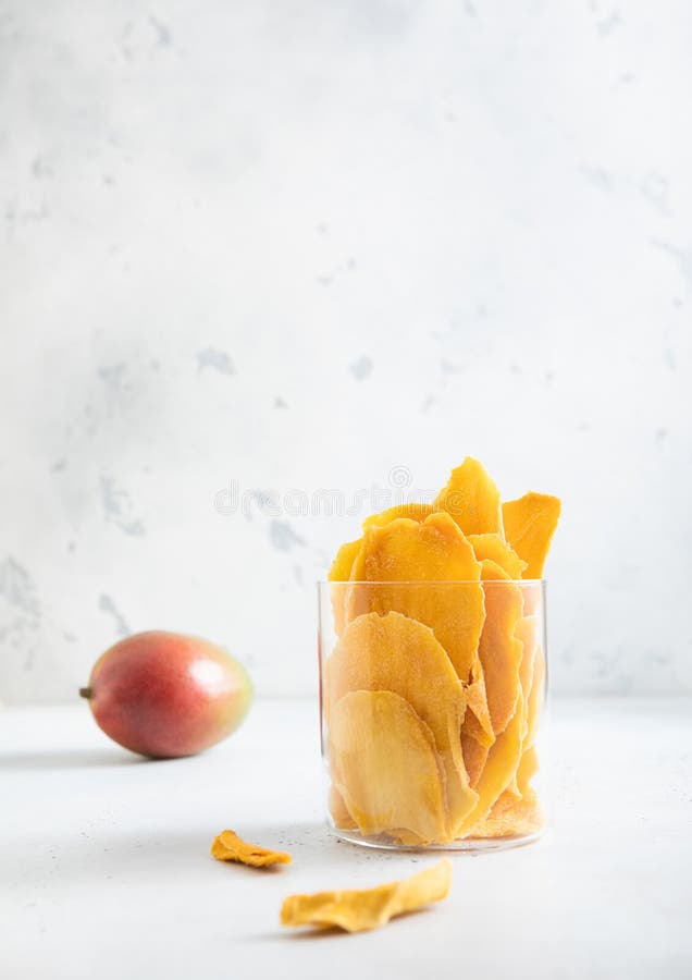 Glass Jar with Large Sweet Dried Mango Slices on Light Background Stock ...