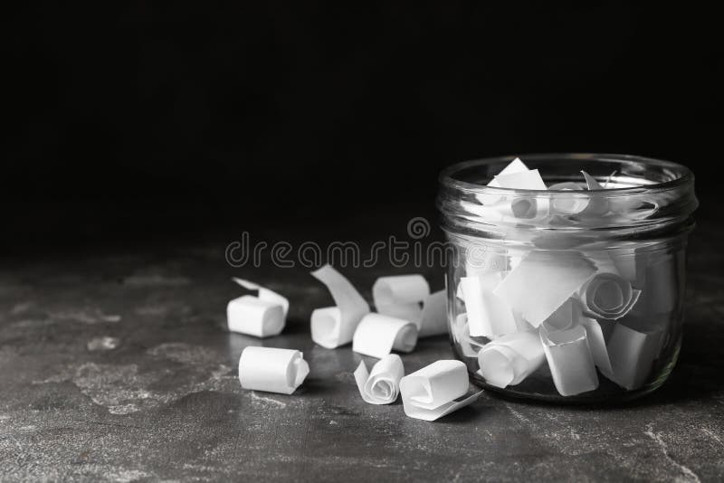 Glass Jar with Paper Pieces on Table, Space for Text Stock Image ...