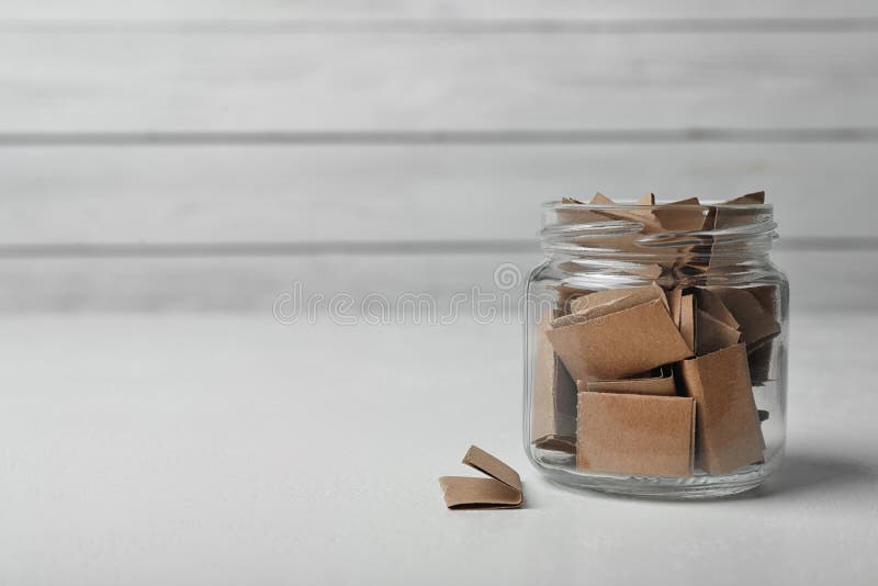 Glass Jar with Paper Pieces on Table, Space for Text Stock Image ...