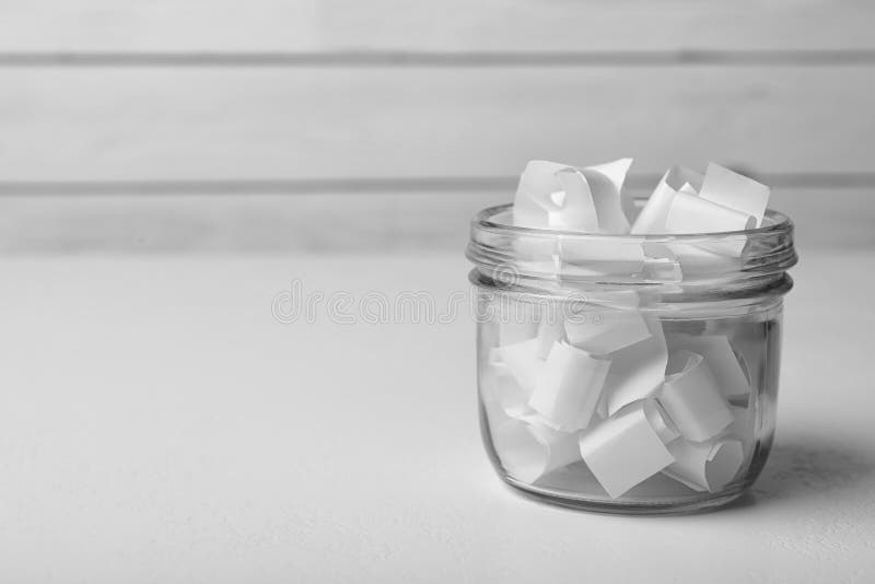 Glass Jar with Paper Pieces on Table, Space for Text Stock Image ...