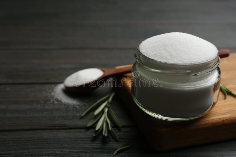 Glass Jar with Salt on Black Wooden Table, Closeup Stock Image - Image ...