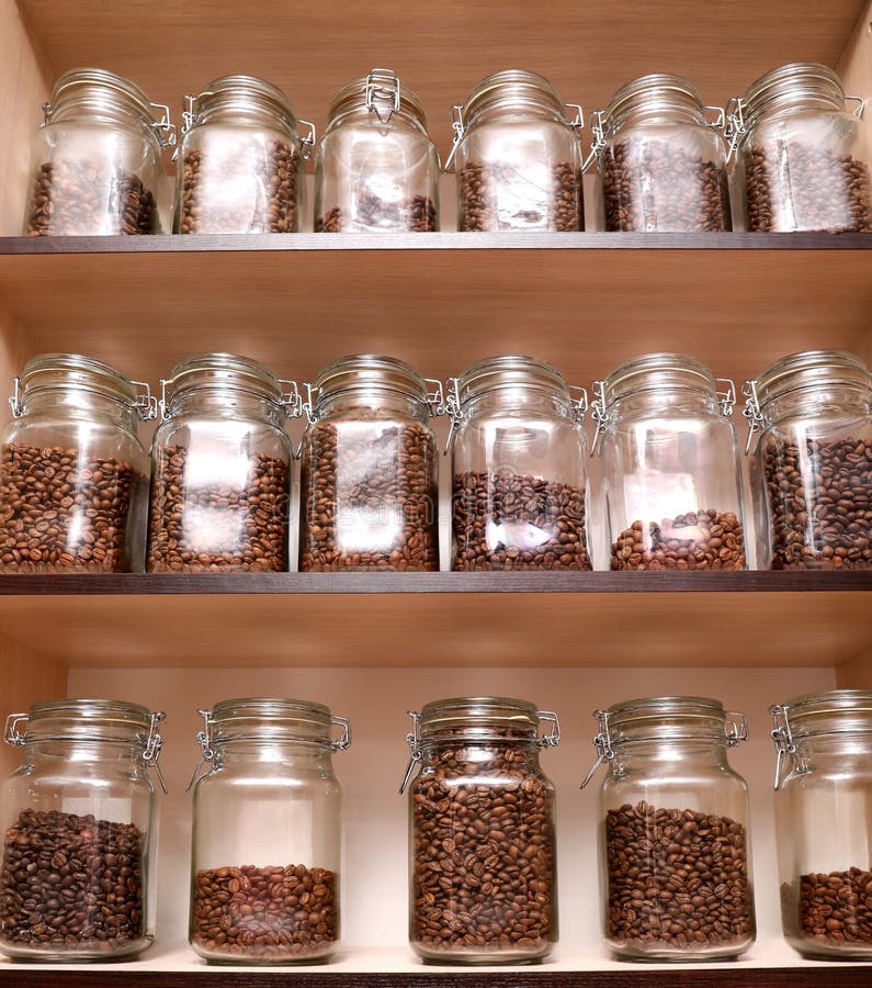 Glass Jars with Coffee Beans on Rack Stock Image - Image of jars ...