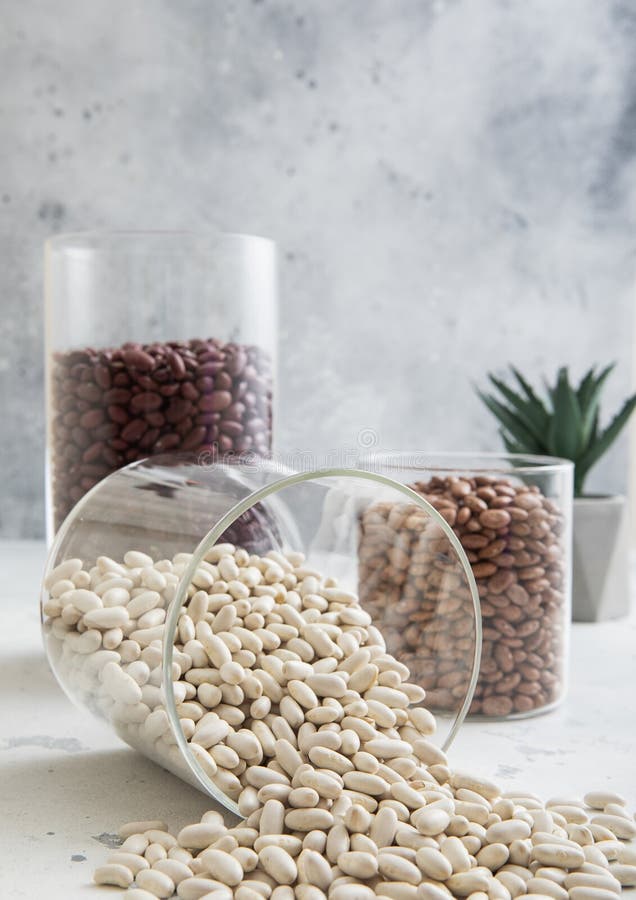 Glass Jars with Purple and White and Variegated Beans on Light Kitchen ...