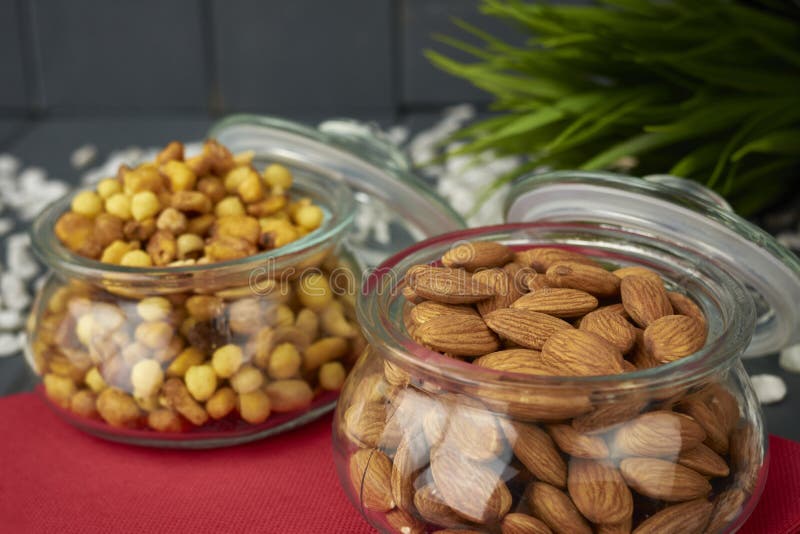 Glass Jars with Snacks. Unpeeled Natural Almonds and Assorted Nuts ...
