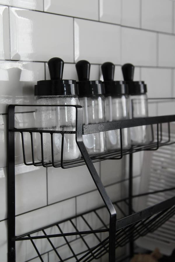 Glass jars stand on shelf stock image. Image of furniture - 237391629