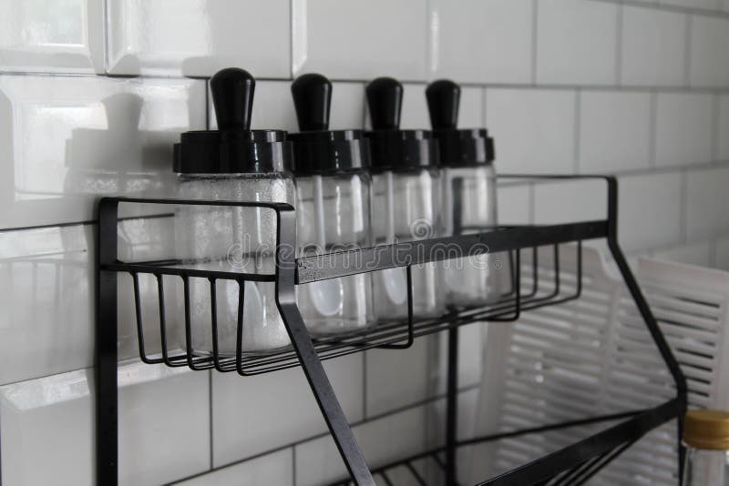 Glass jars stand on shelf stock photo. Image of house - 237391634