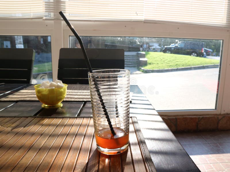 A Glass of Juice is on the Table the Sun`s Rays Illuminate. Stock Photo ...