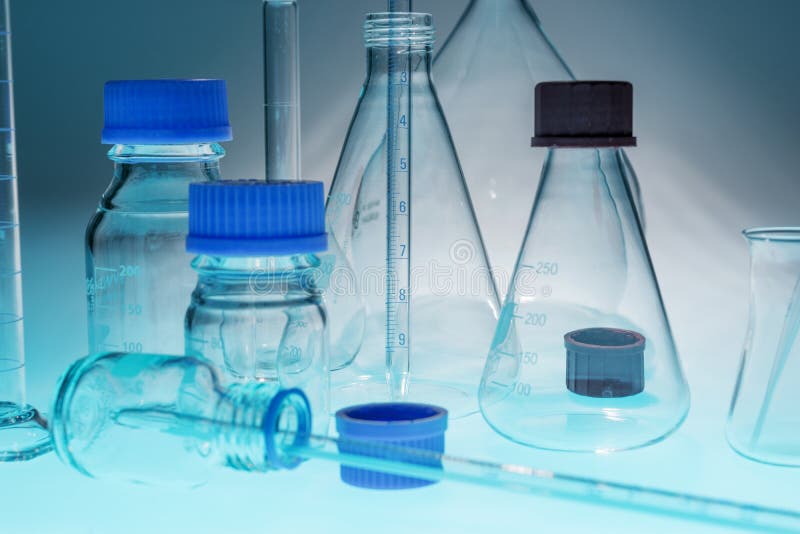 Glass Laboratory Apparatus on Blue Table Stock Photo - Image of color ...
