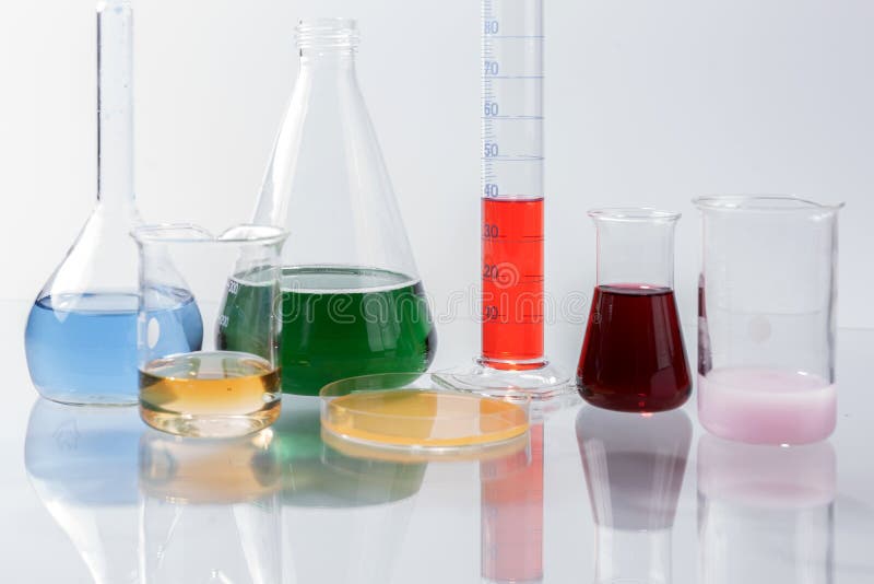Glass Laboratory Apparatus with Color Water on the Table Stock Image ...
