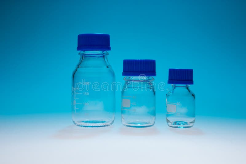 Glass Laboratory Apparatus with Color Water on the Table Stock Image ...