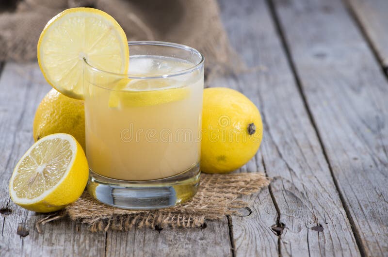 Glass with Lemon Juice stock photo. Image of juicy, portion - 40124198