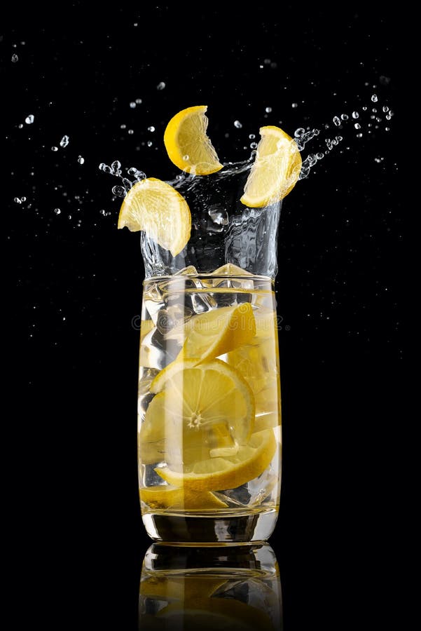 Lemonade Splashing on Green Lemon Fruit Isolated on Green Background ...