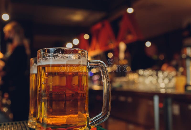 Glass of Light Beer on a Dark Pub. Stock Photo - Image of drink, liquid ...